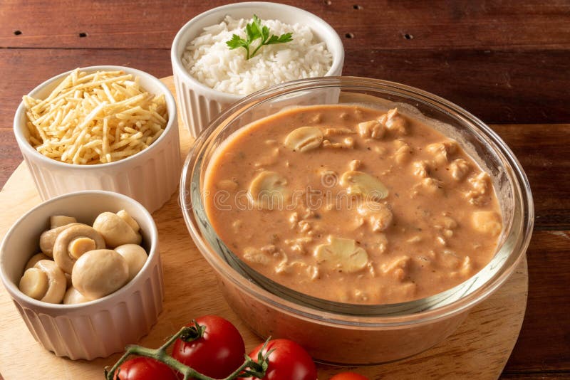 Chicken Stroganoff Accompanied with Rice, Salad and Potato Straw Stock ...