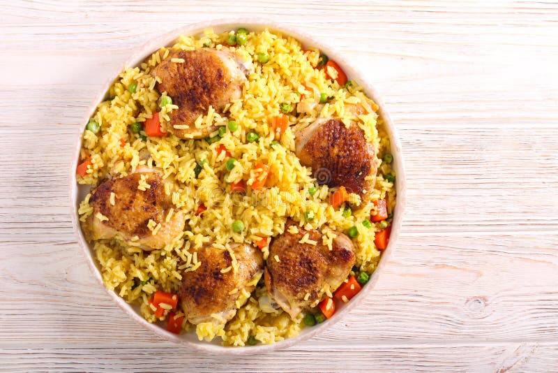 Chicken Thighs with Rice, Carrot and Peas Stock Photo - Image of rice ...