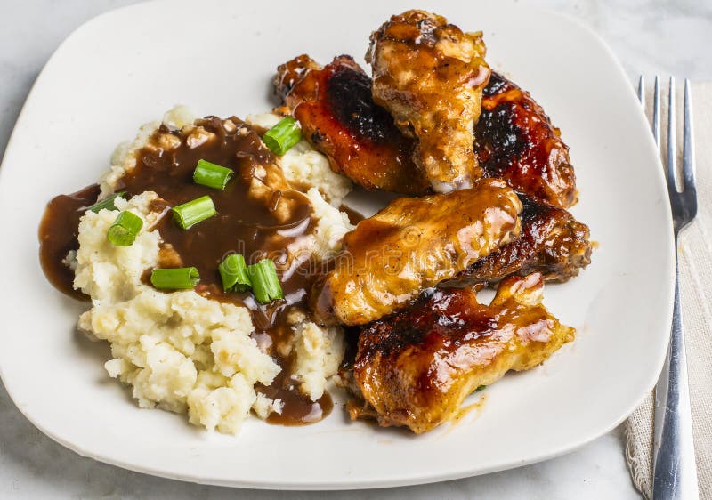 Chicken Wing in Barbecue Sauce Stock Photo - Image of scallions ...