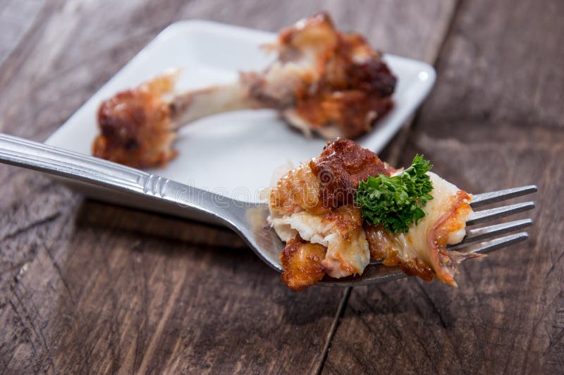 Chicken Wing on a Fork (wooden Background) Stock Photo - Image of ...