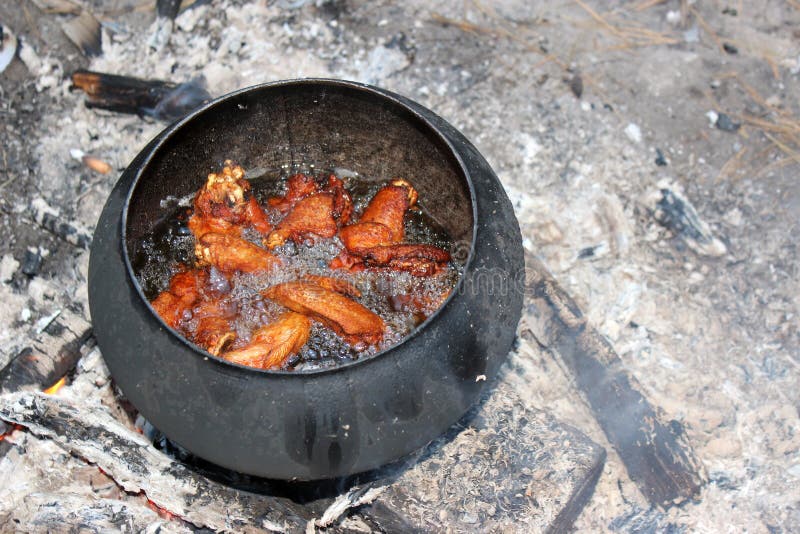 Chicken Wings Deep-fried in a Pot on a Fire Stock Photo - Image of ...