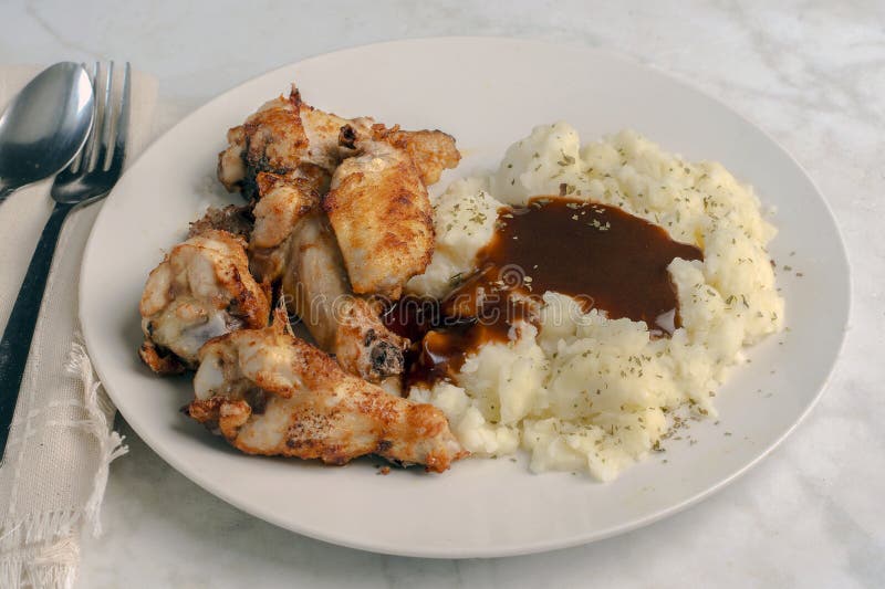 Chicken Wings and Drumsticks with Mashed Potatoes Stock Image - Image ...