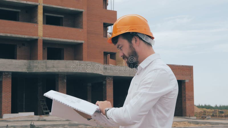 Chief Architect at Construction Site. Chief Architect in a Hard Hat at ...