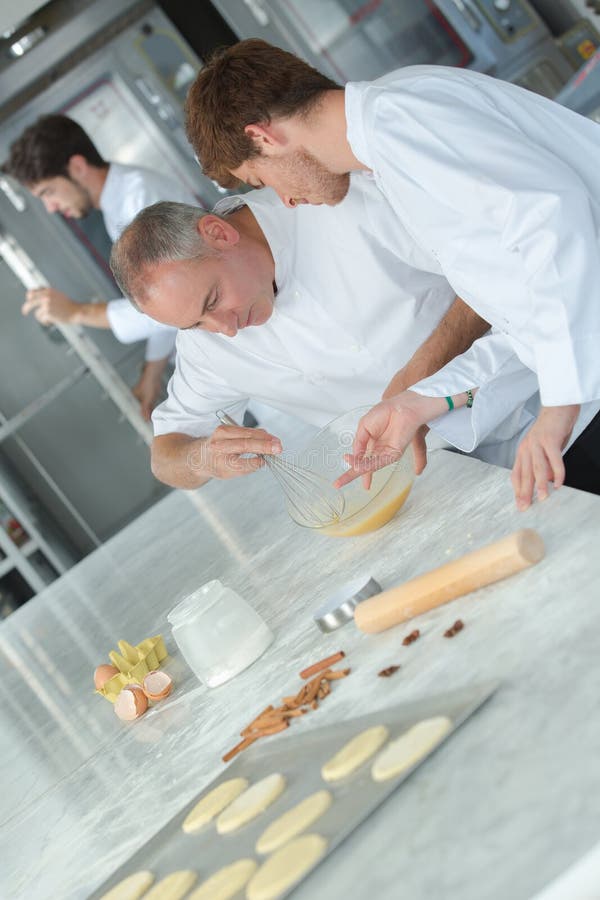Chief chef and assistant stock image. Image of chief - 95597255