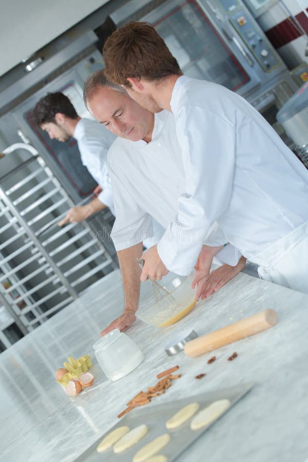 Chief Chef Teaching Assistants in Restaurant Kitchen Stock Image ...