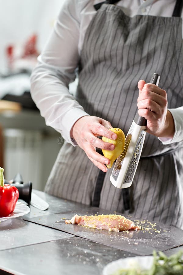 Chief Chops and Marinates Chicken. Professional Chef in a Kitchen of ...