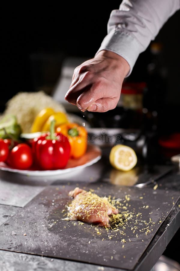 Chief Chops and Marinates Chicken. Professional Chef in a Kitchen of ...