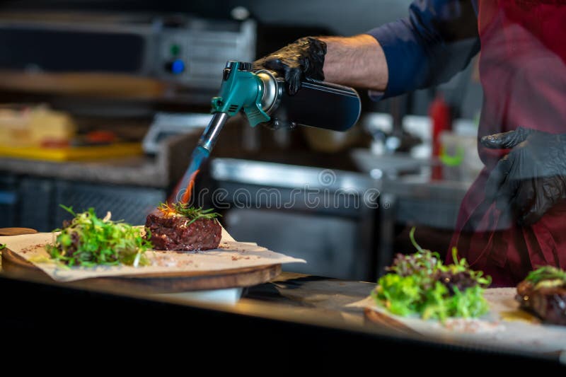 A Chief-cooker Cooking in the Kitchen in the Restaurant Stock Photo ...