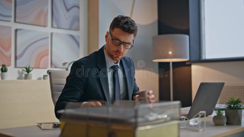 Chief Designer Examining Documents at Modern Workspace Closeup. Guy ...