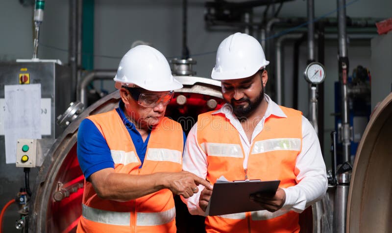 Chief Engineer of a Mechanical Plant Inspecting and Explaining the ...
