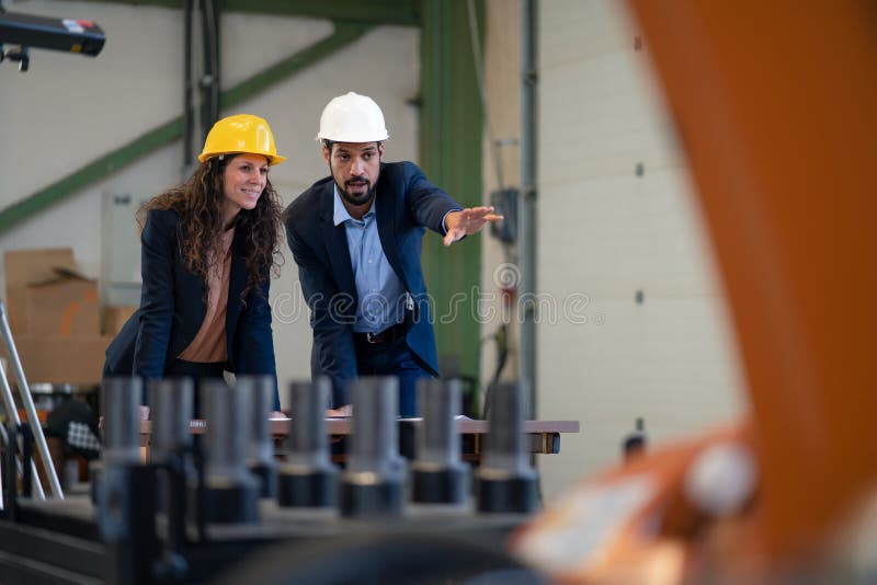 Chief Engineer and Project Manager in Modern Industrial Factory with ...