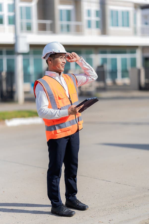 The Chief Engineer is Taking Notes on a Tablet while Inspecting a Two ...