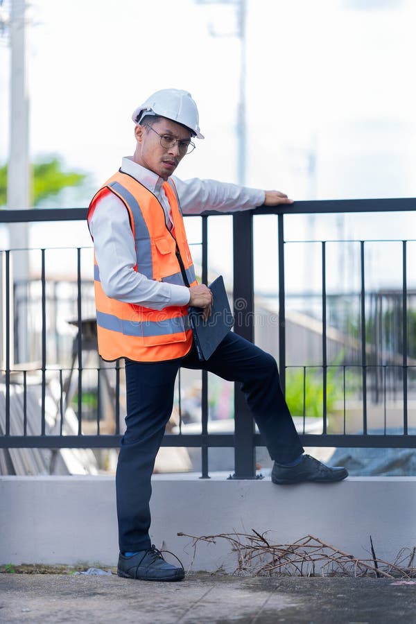 The Chief Engineer is Taking Notes on a Tablet while Inspecting a Two ...