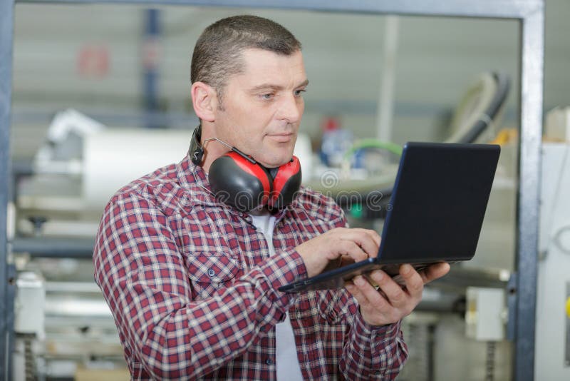 Chief Engineer Using Laptop in Factory Stock Image - Image of manager ...