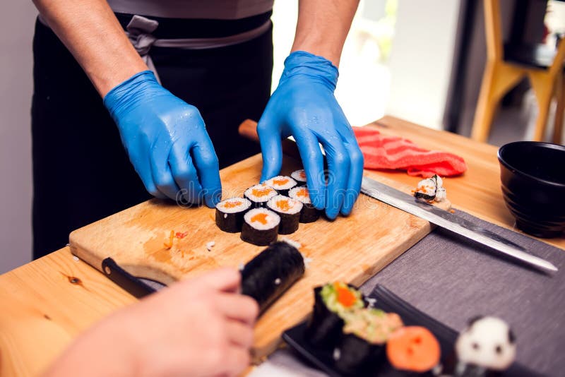 A Chief Making Sushi. Asian Food Preparation Stock Photo - Image of ...