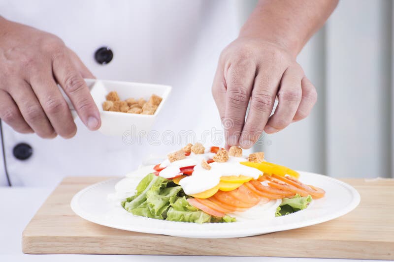 Chief Sprinkle Biscuits on Salad Stock Photo - Image of cooking, food ...