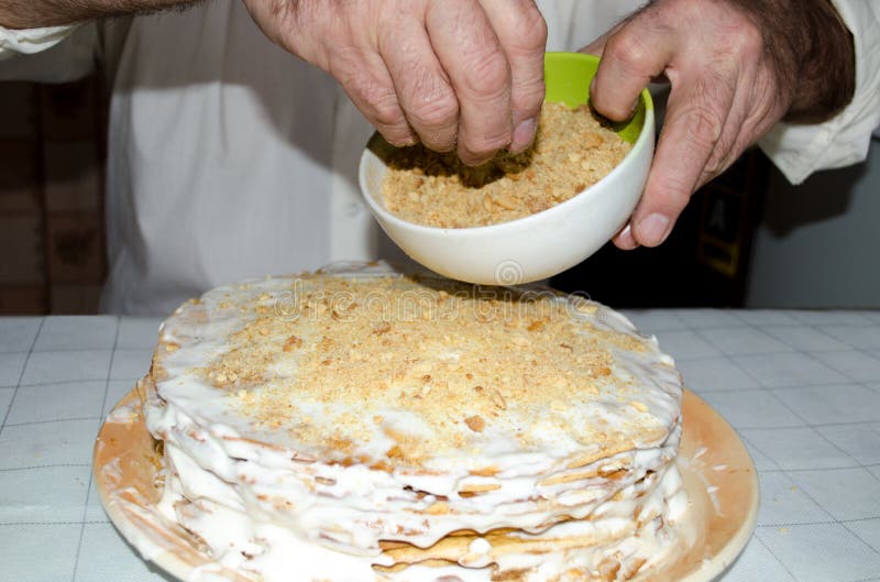 Chief Sprinkling Biscuit Crumbs on Holiday Cake Stock Image - Image of ...