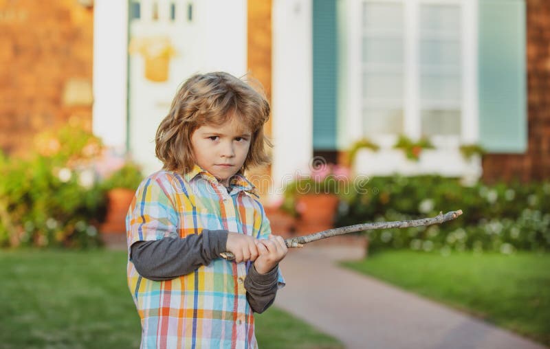 Child Aggression. Negative Kids Emotion. Angry Boy with Stick. Kid ...