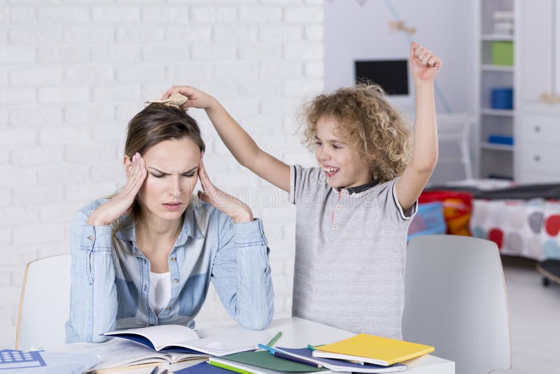 Child annoying his mother stock photo. Image of care - 84883438