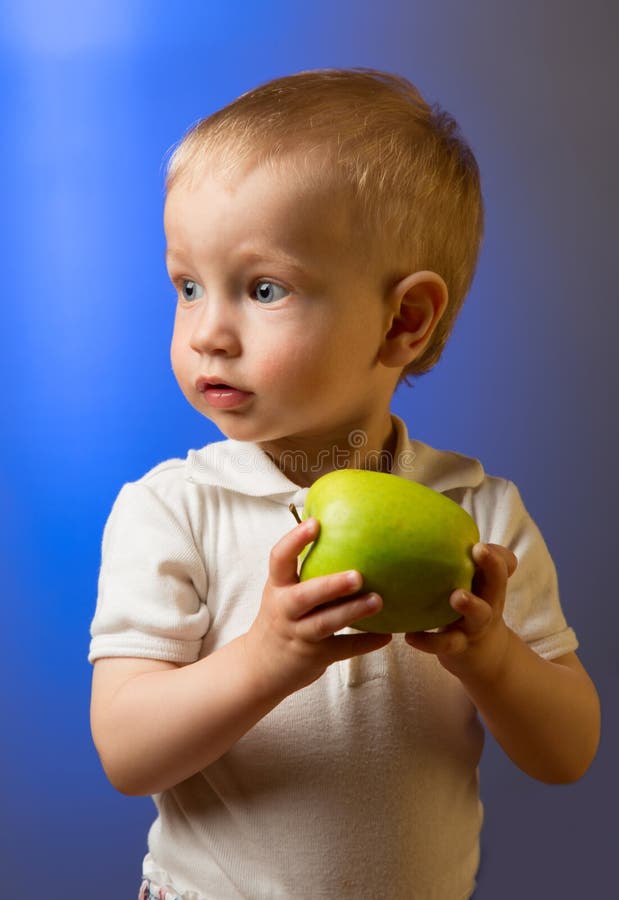 Child with apple stock photo. Image of yellow, little - 25661660