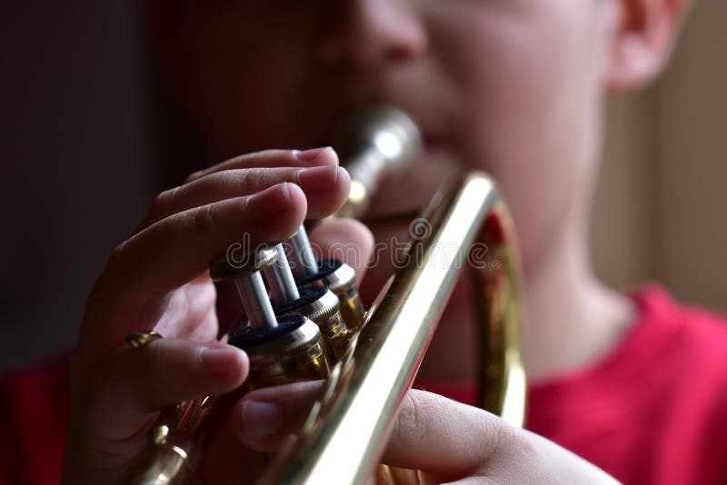 Child artist on a trumpet stock image. Image of mouth - 267295973