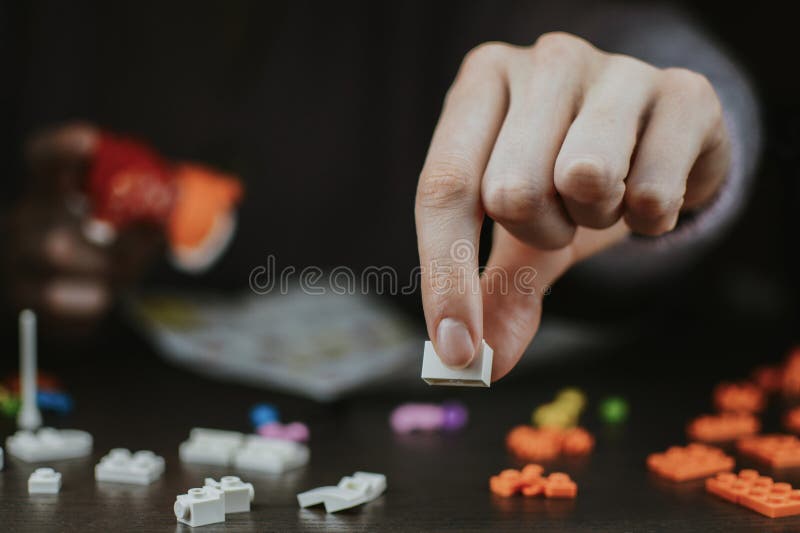 Child Assembles Multi Colored Lego Blocks His Own Hands Stock Photos ...