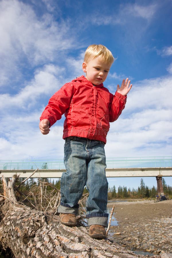 Child balancing on log stock image. Image of sunny, balance - 9097179