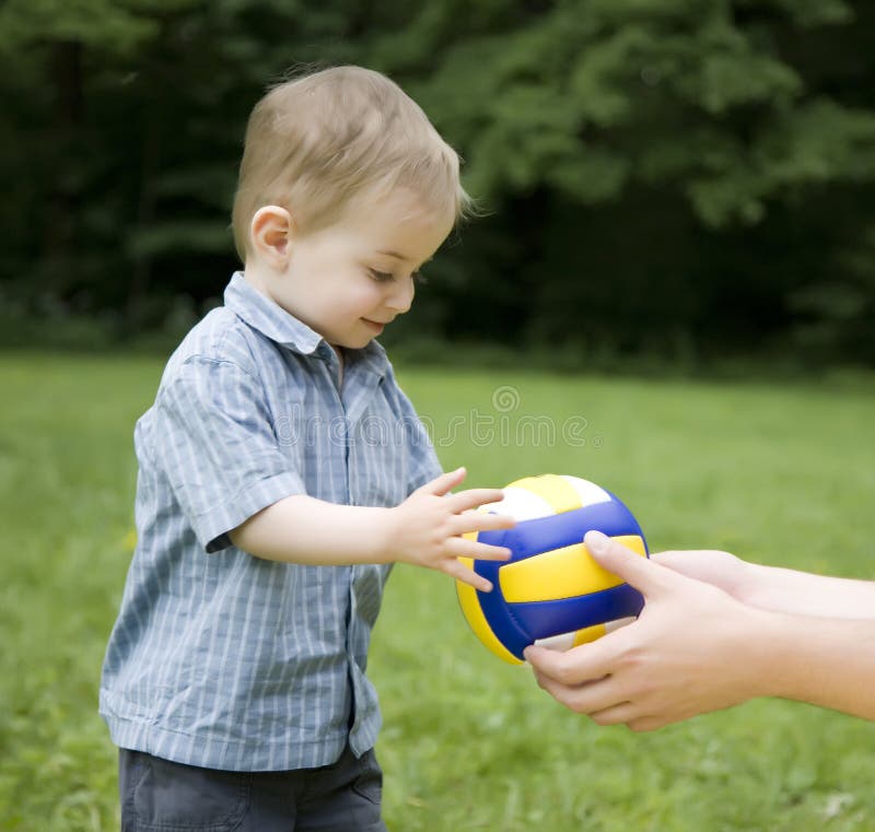 The Child and a Ball stock image. Image of expression - 5517661