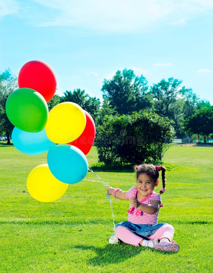 Child with Balloons on the Field Stock Image - Image of person, african ...