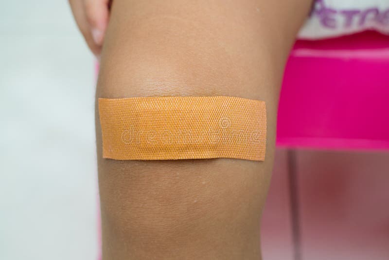 Close Up. Child Injured. Wound On The Child's Knee With Bandage. Stock ...