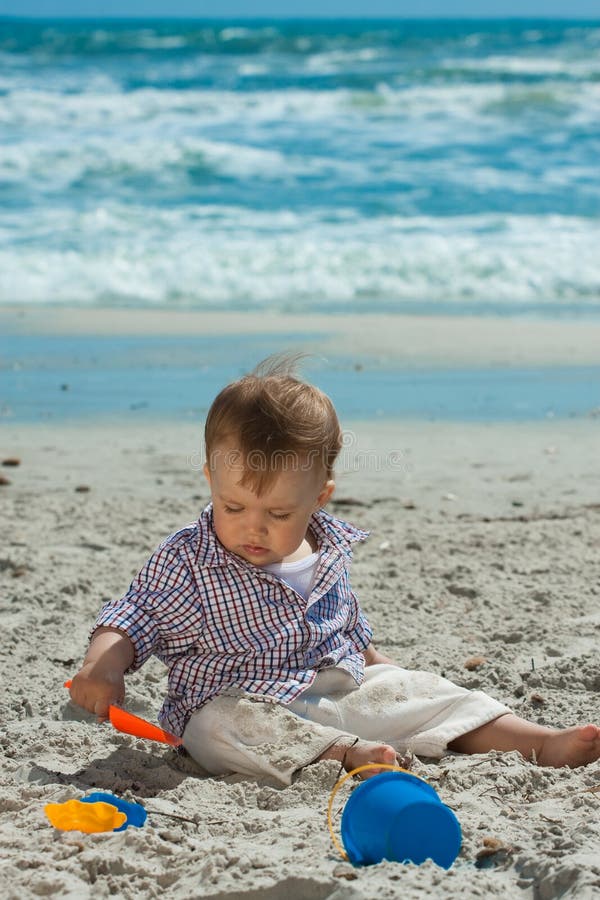 Child on a beach stock photo. Image of blue, beach, coast - 14242198