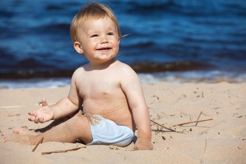 Child on a beach stock image. Image of cute, blue, little - 14242387