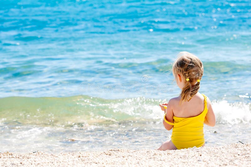 Child on the beach stock image. Image of bright, preschooler - 26028071