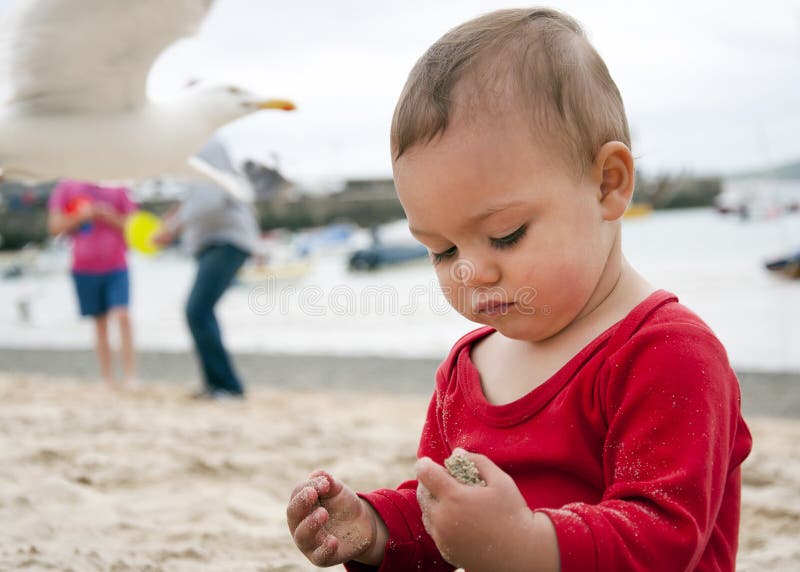 Child on beach stock photo. Image of england, cloud, childhood - 28229984