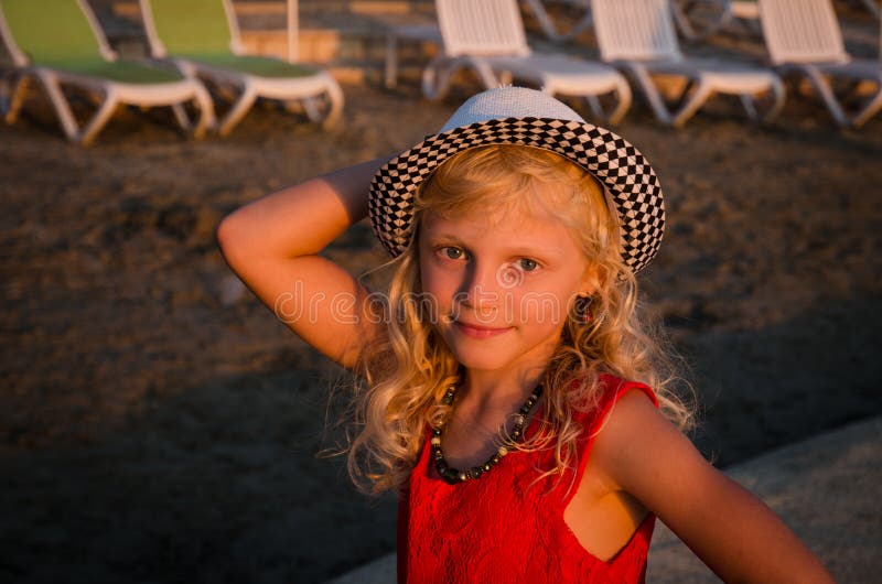 Child in the beach stock photo. Image of sunset, holiday - 72558556
