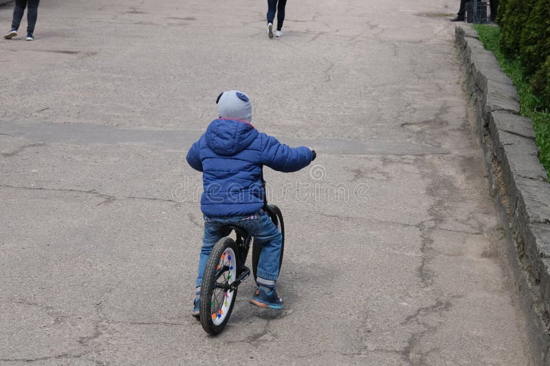 Child on a Bicycle Rear View. Editorial Photography - Image of sports ...