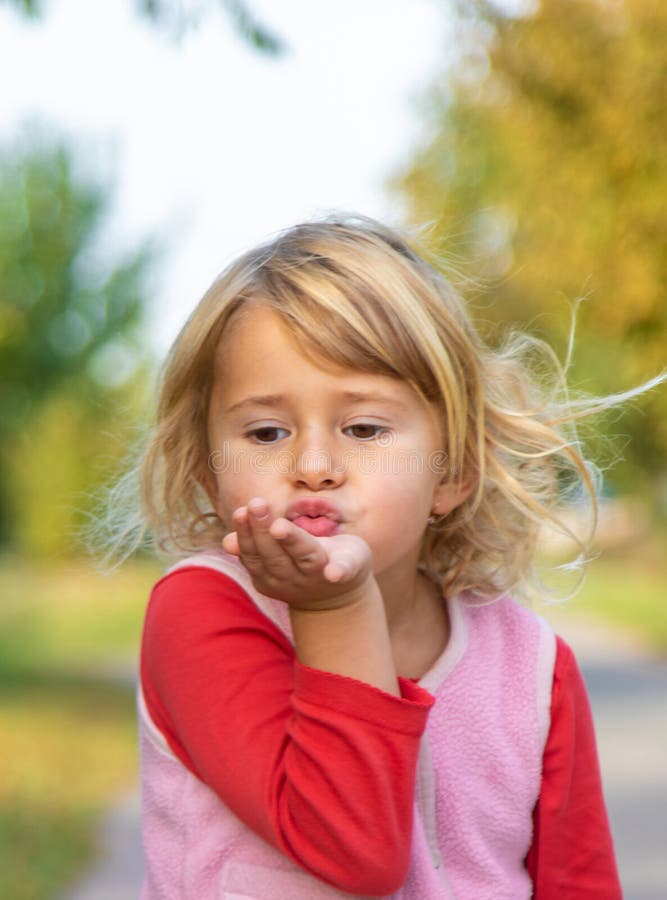 Child Blowing a Kiss. Selective Focus Stock Photo - Image of playing ...