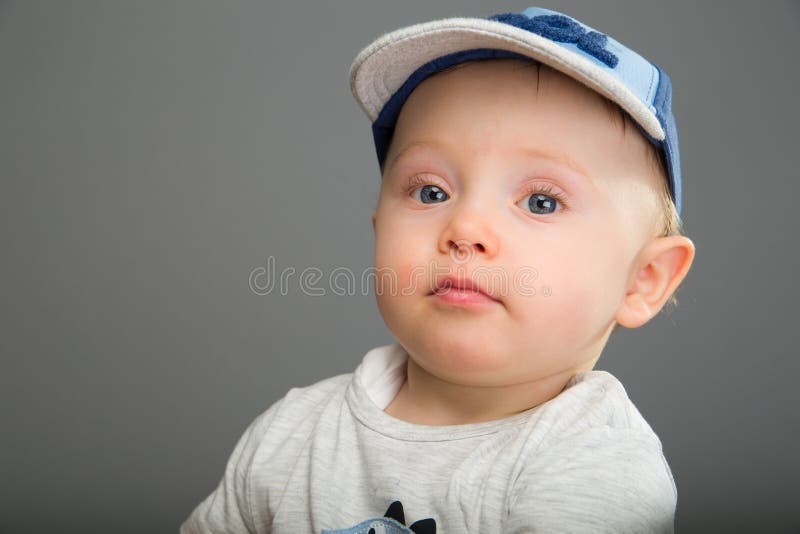 Child in blue cap stock image. Image of blue, little - 53980469