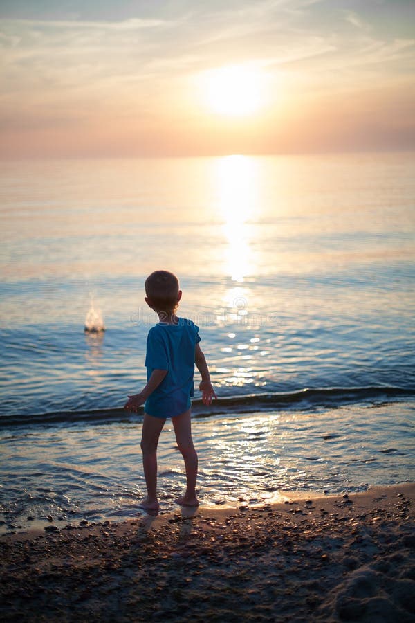 Child Boy on Beach Sunset Backlight Stock Photo - Image of stone ...