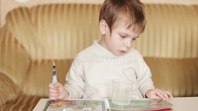 Child Boy Draws with a Water Marker Stock Video - Video of children ...