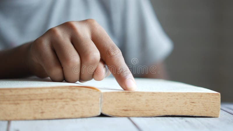 Child Boy Hand Reading a Book on a Table , Stock Video - Video of ...