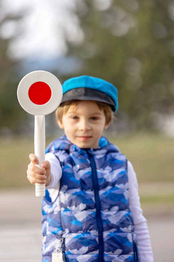 Child, Boy, Holding Start Stop Policeman Control Traffic Paddle Stock ...