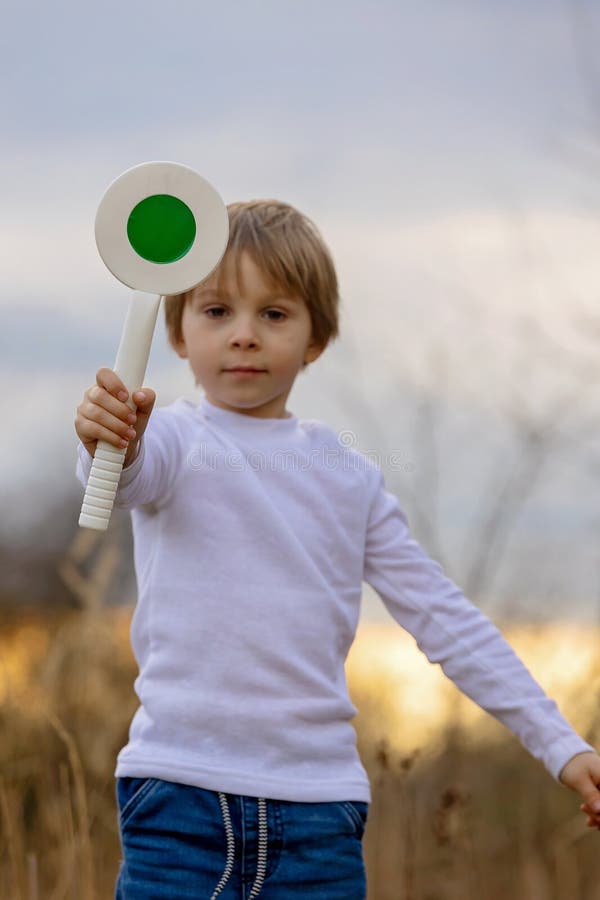 Child, Boy, Holding Start Stop Policeman Control Traffic Paddle Stock ...