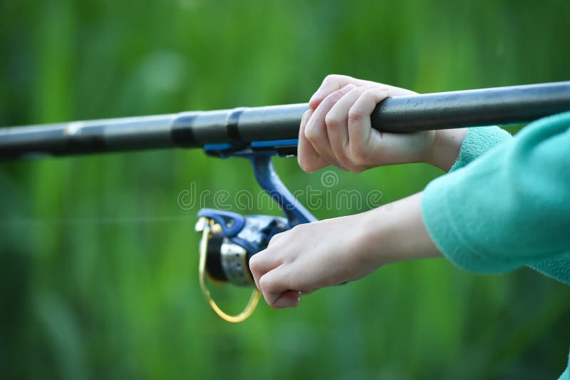 Child Boy Holds Fishing Rod Stock Image - Image of spinning, river ...