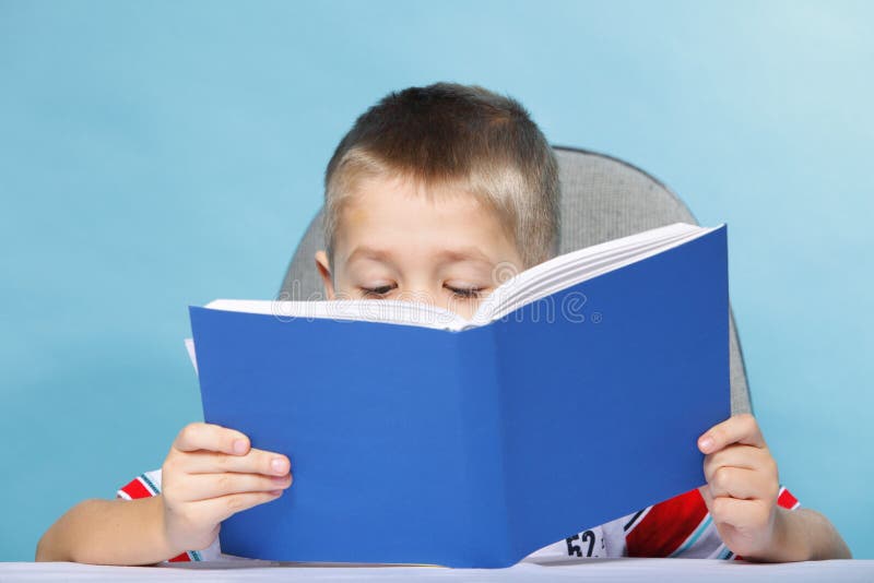 Child Boy Kid Reading a Book on Blue Stock Image - Image of child ...