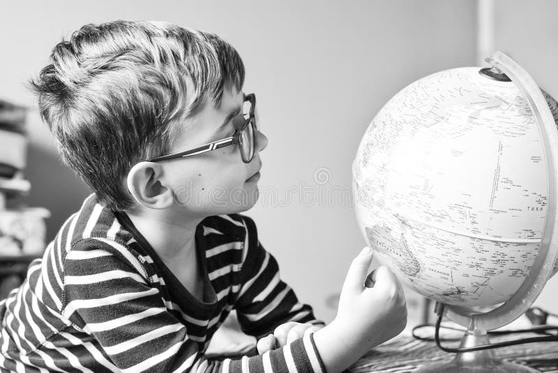 Child Learning Geography with Globe at Home Stock Image - Image of ...