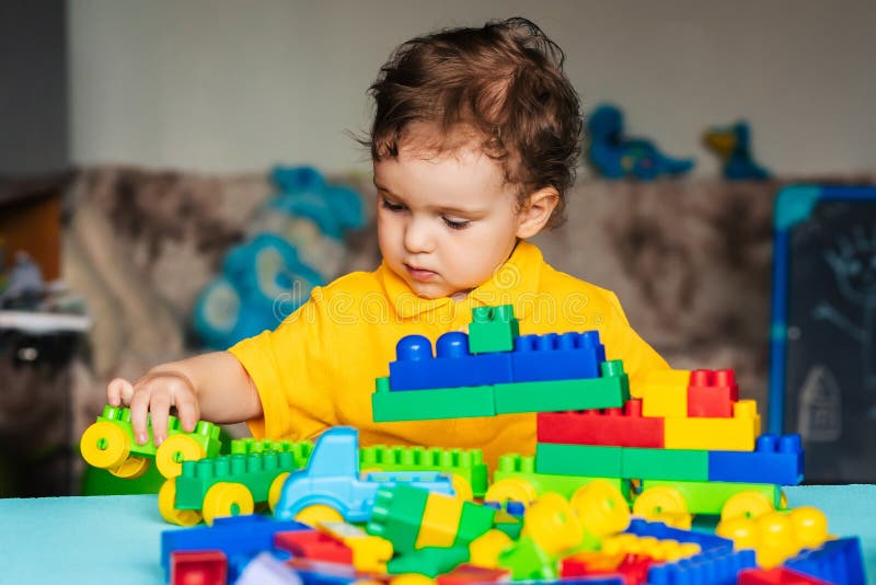 Child Boy Learns To Build a House from Blocks Stock Image - Image of ...