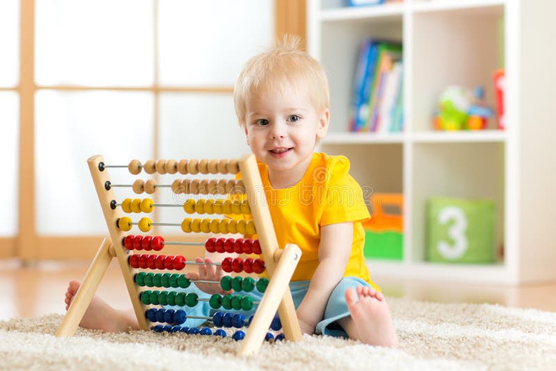 Child Boy Playing with Counter Toy at Home Stock Image - Image of ...