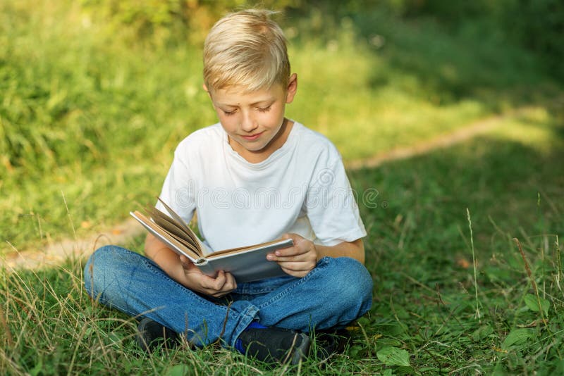 Child Boy Reading Book Outside. Concept of Back To School, Learning ...