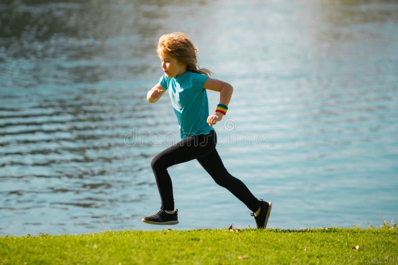 Child Boy Running Outdoors. Child Runner Jogger Running in the Nature ...